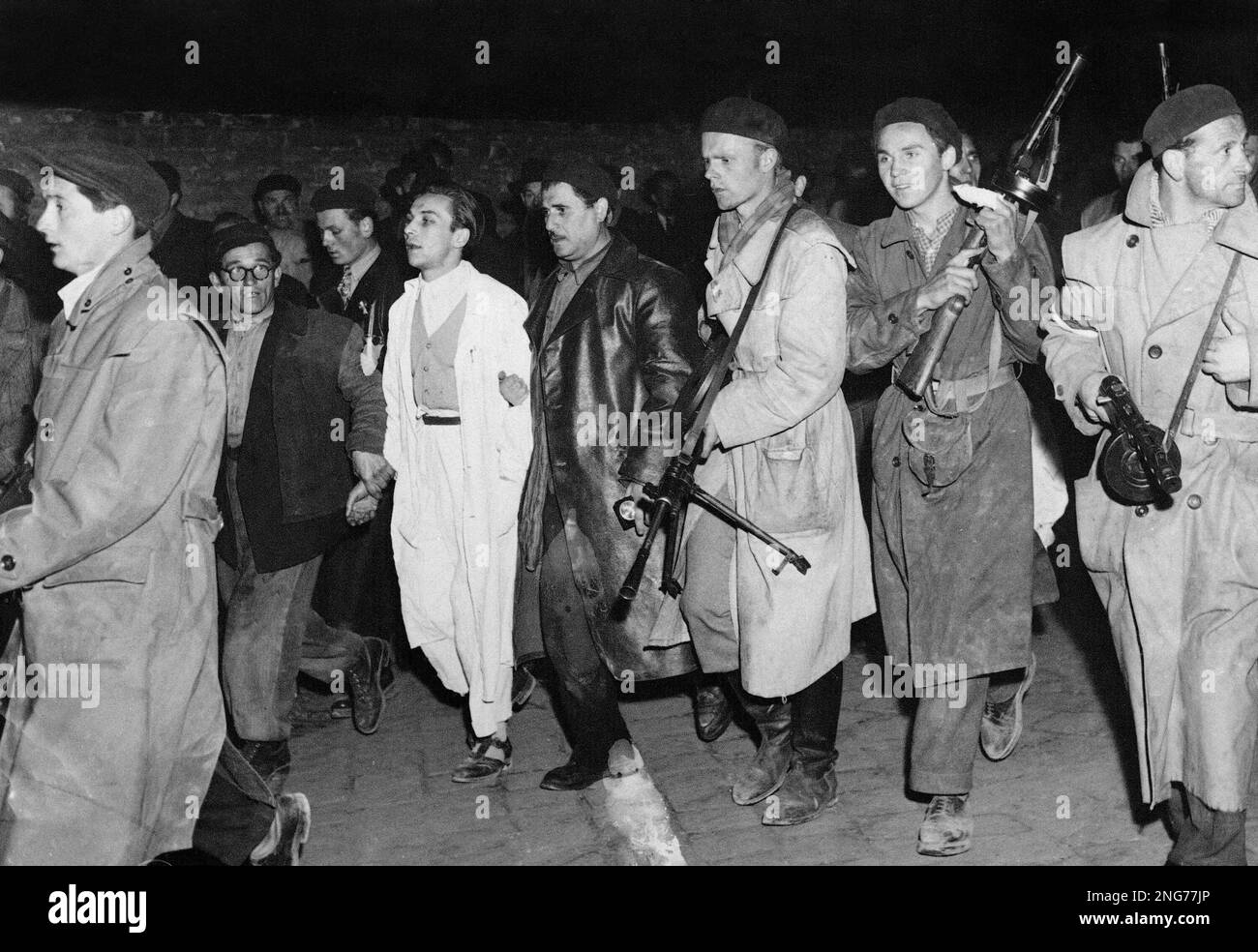 A group of Hungarian rebels, some with weapons, have in custody a ...