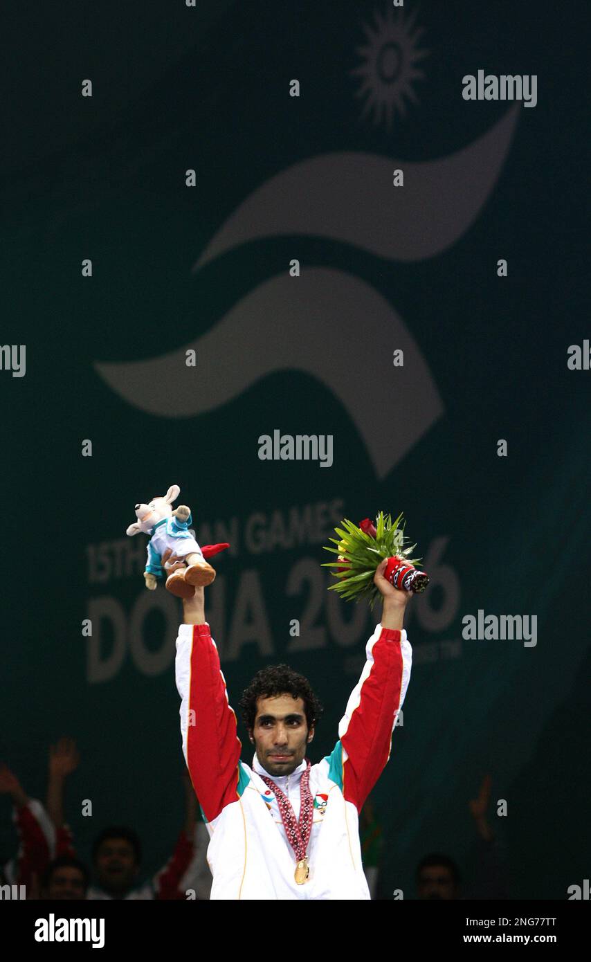 Iran's Hossein Rouhani celebrates his gold medal victory after ...