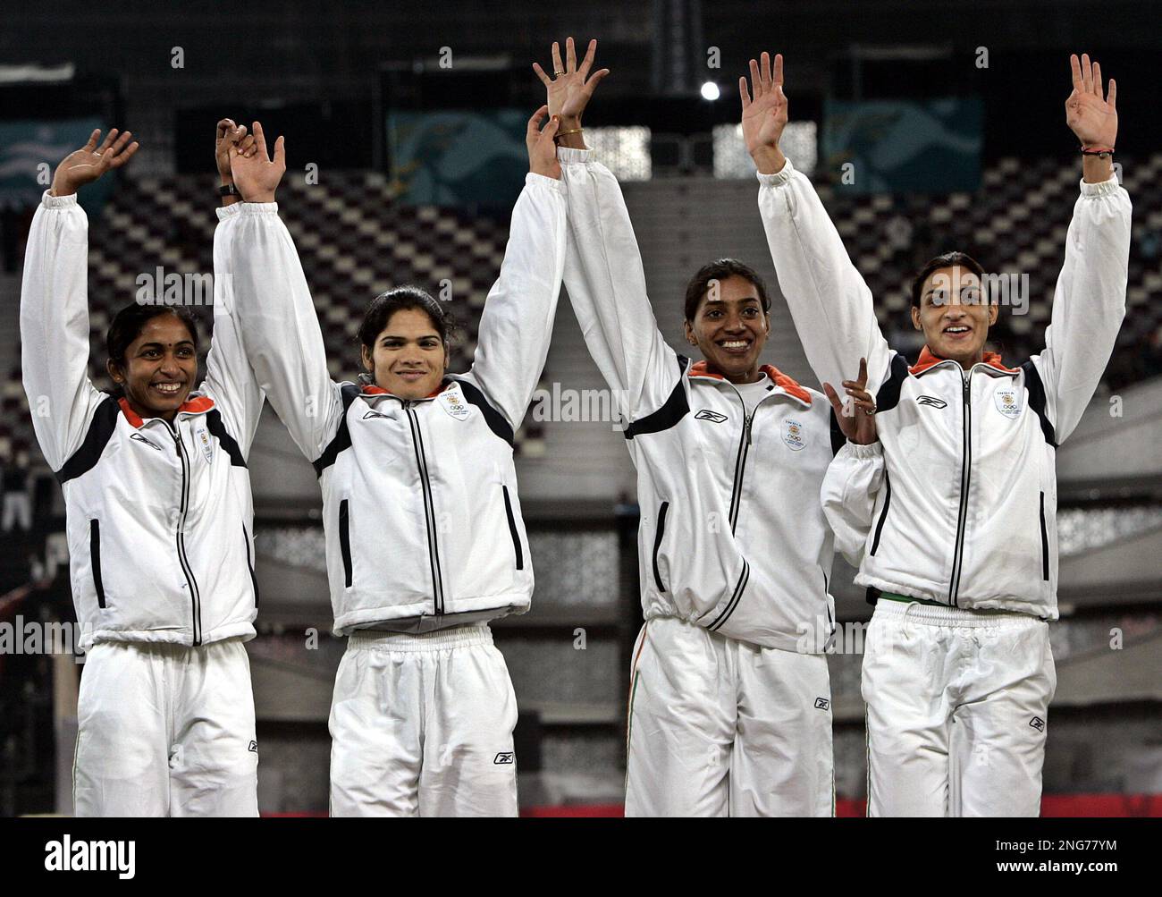 The Indian team celebrate before receiving the the gold medals they won ...