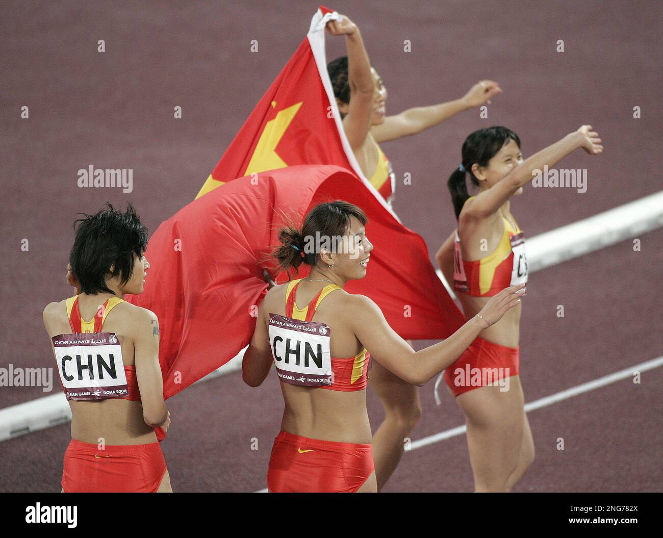 The Chinese team celebrate after winning the gold medal in the final of ...