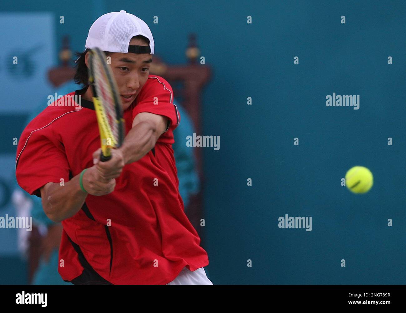 Japan's Go Soeda makes a backhand return againstThailand's Udomchoke ...