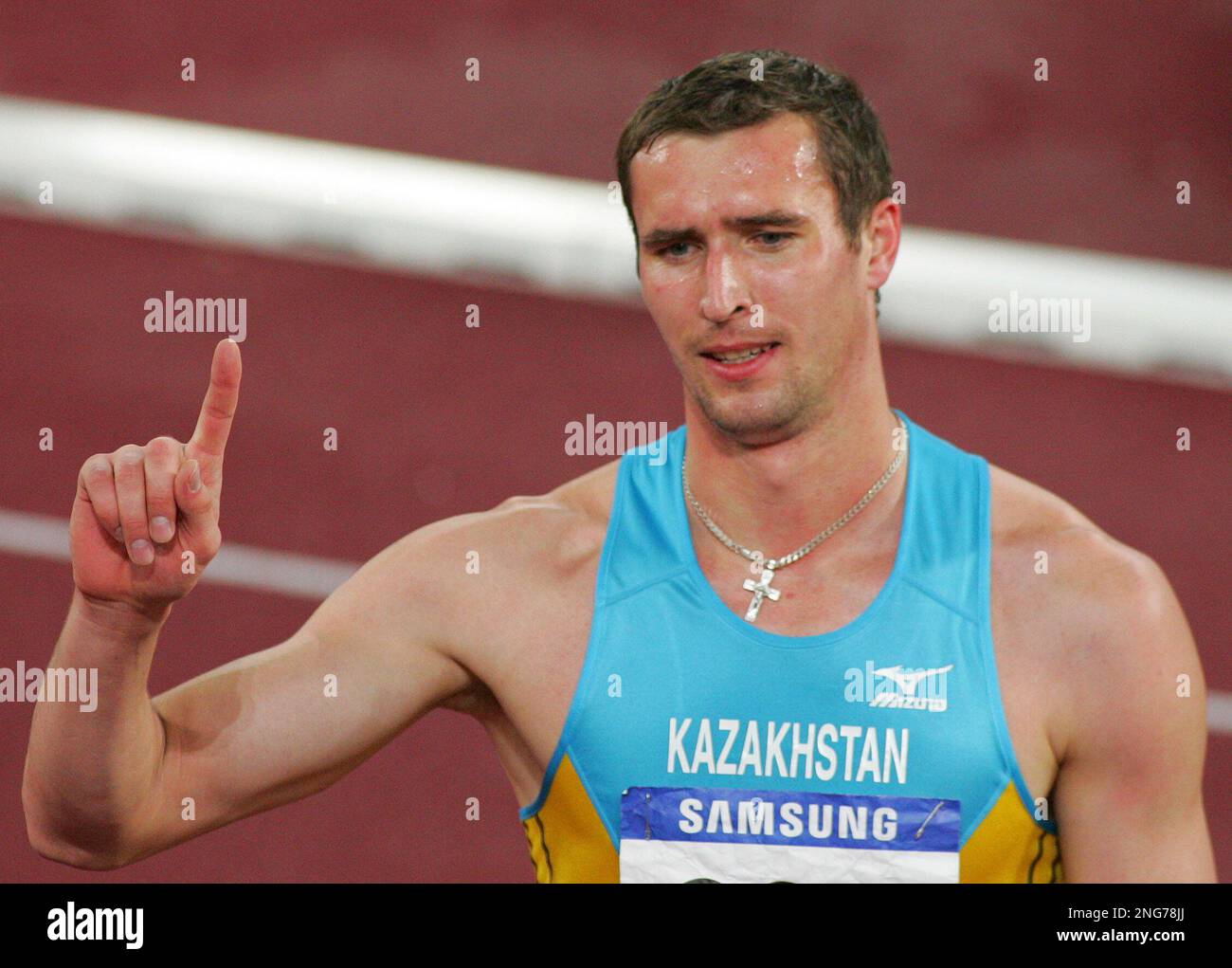 Kazakhstan's Dmitry Karpov gestures after finishing the Decathlon 1500m and clinching the gold ...