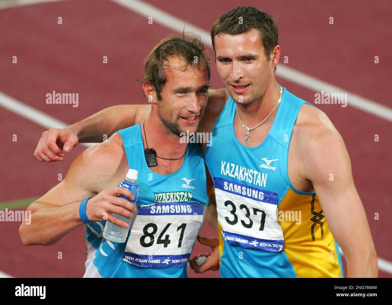Kazakhstan's Dmitry Karpov, right, embraces Uzbekistan's Vitaliy Smirnov after finishing the ...
