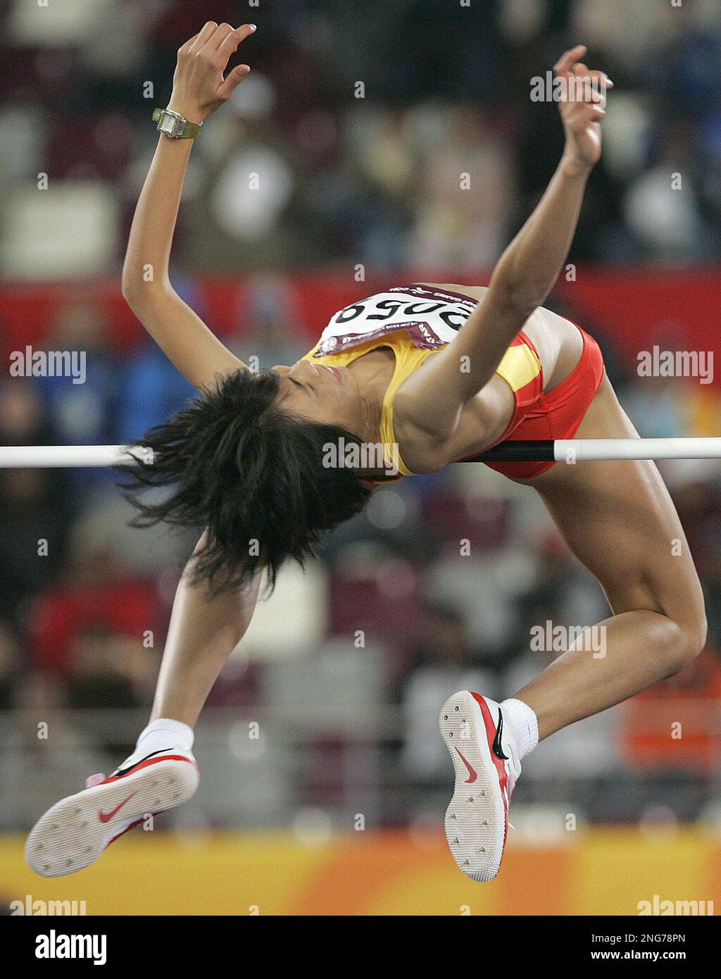 China's Zheng Xingjuan makes a clearance on her way to winning the ...