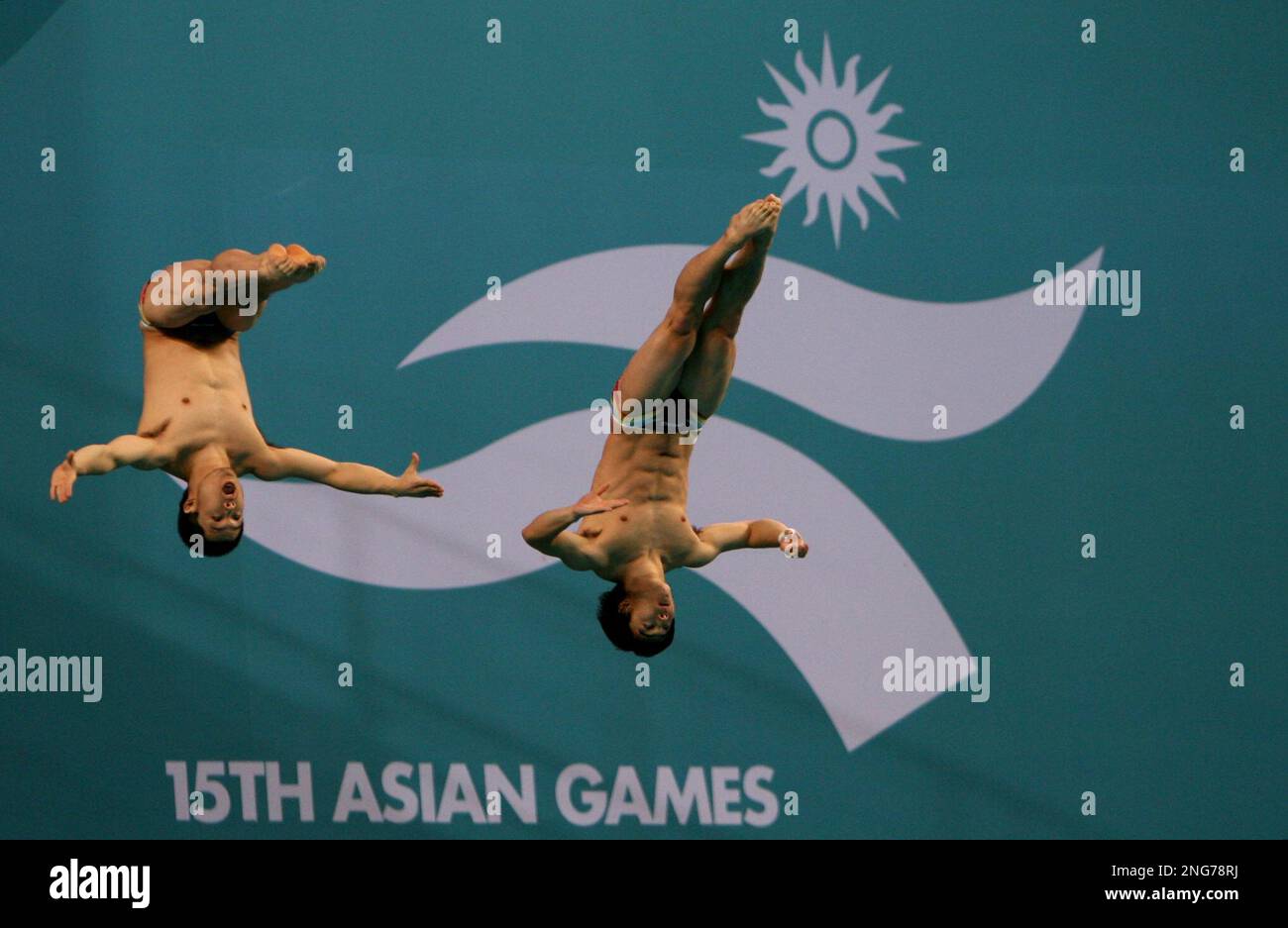 North Korean divers, Ri Jong Nam and Kim Chon Man perform their dive ...