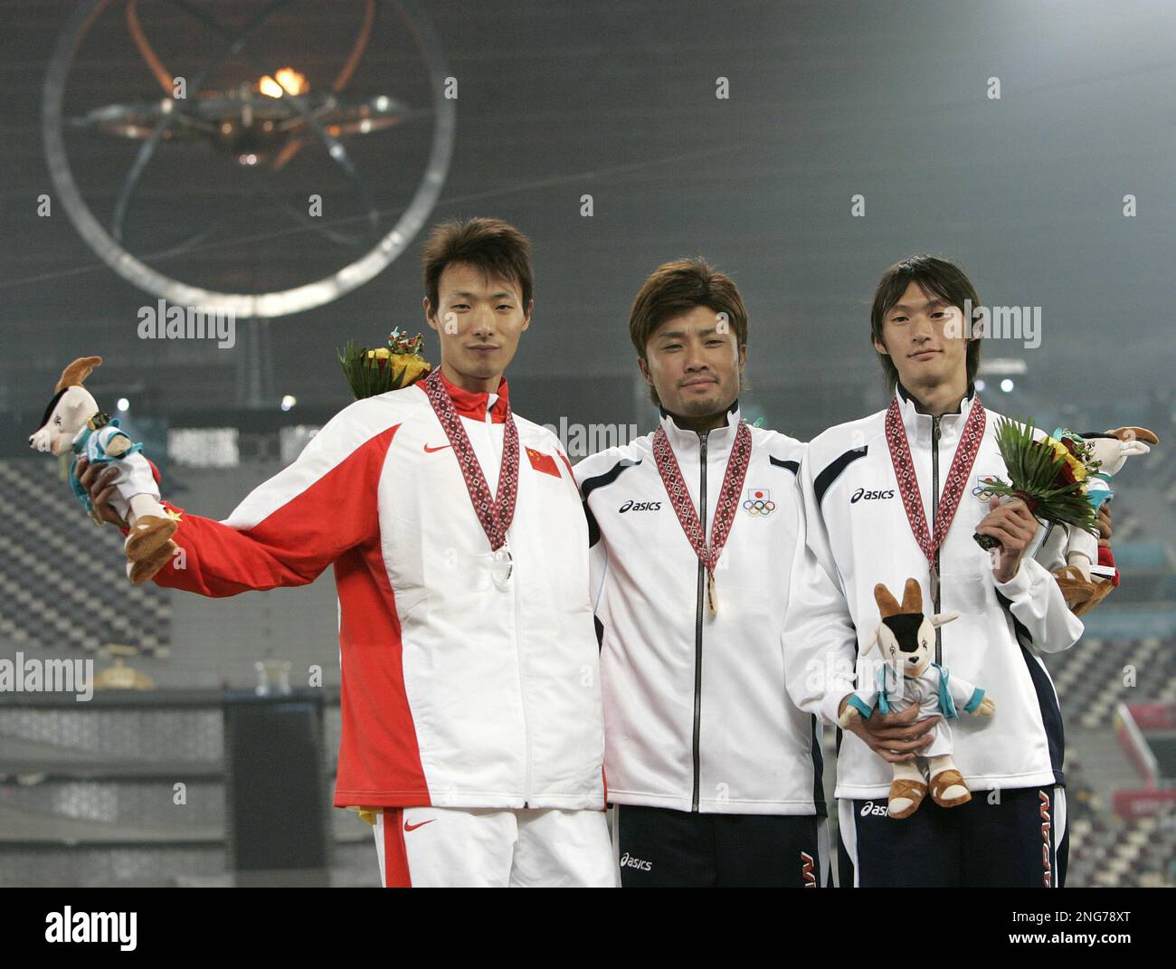 Japan's Shingo Suetsugu, with the gold medal he received during the ...