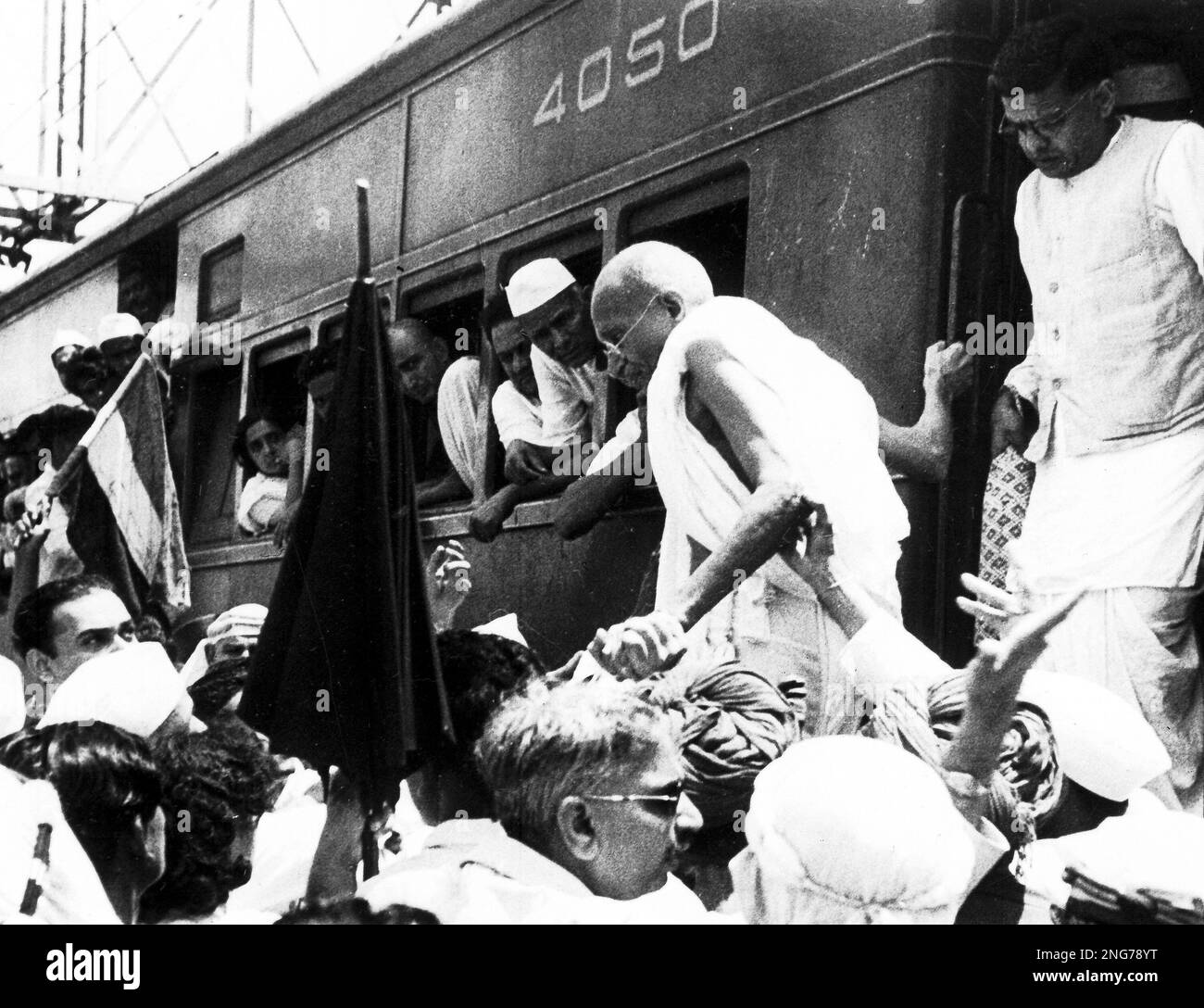 Indian National Congress Party leader Mahatma Gandhi, centre, leaves a ...