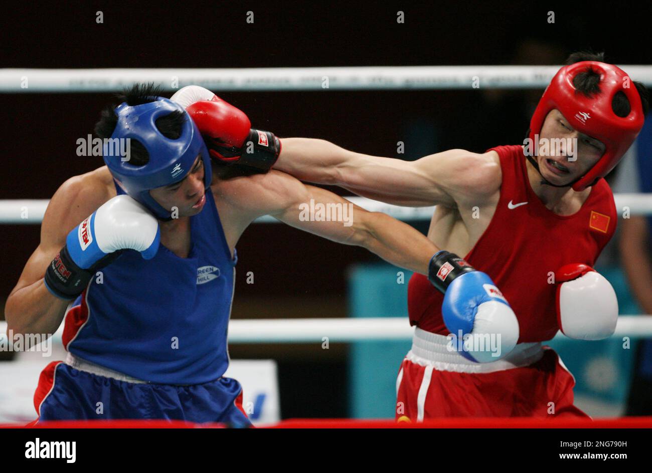 Hu Qing of China, right, and Genebert Basadre of the Philippines ...