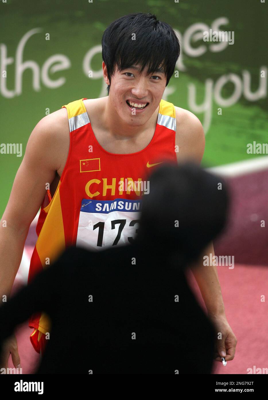 China's Liu Xiang smiles after winning his Men's 110m hurdles heat at ...