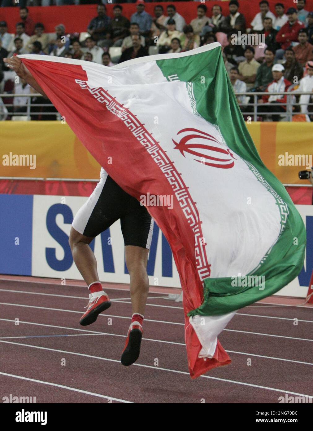 Iran's Ehsan Hadadi celebrates after he won the gold medal in the final ...