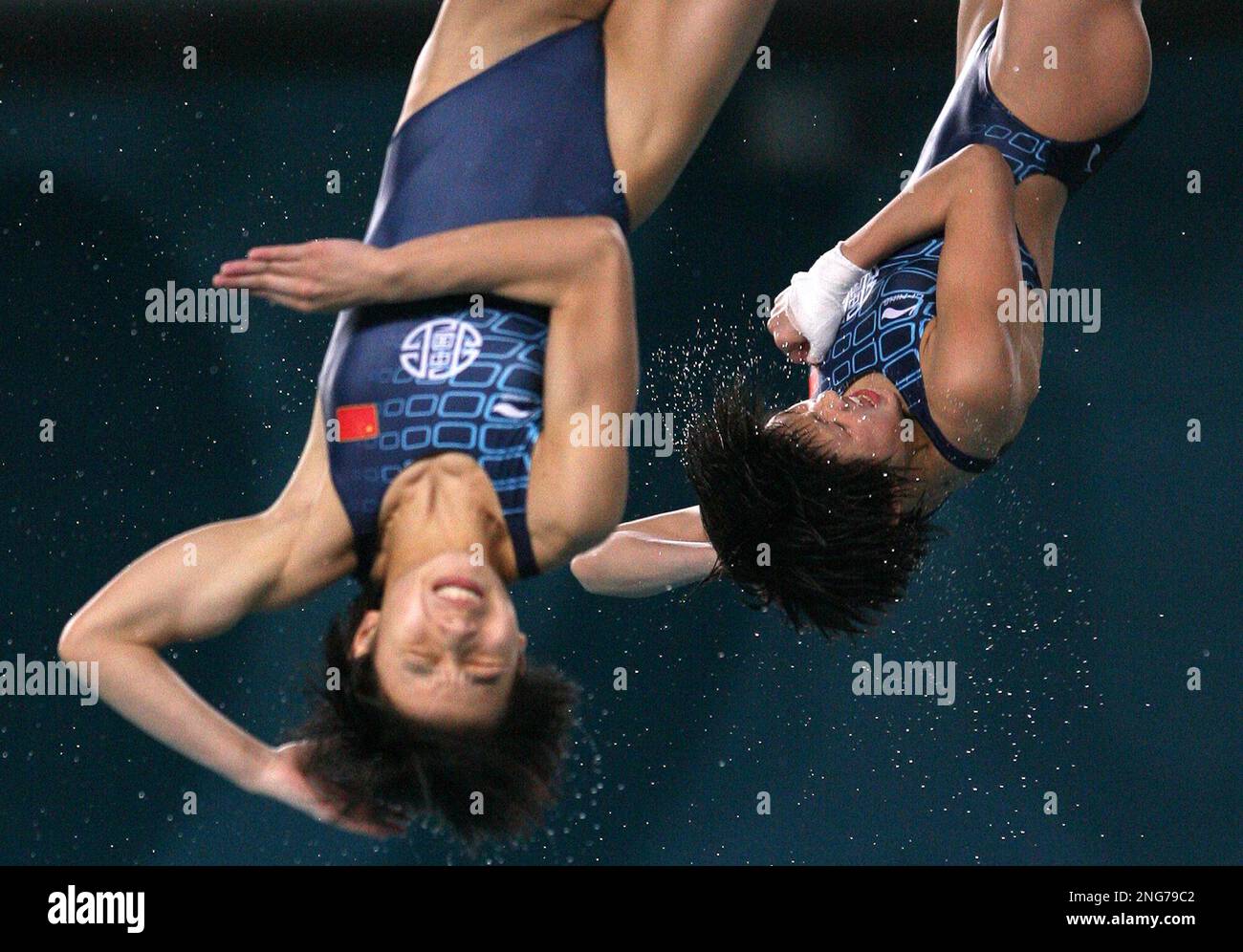 China's Jia Tong, left, and Chen Ruolin performs their dive during the ...