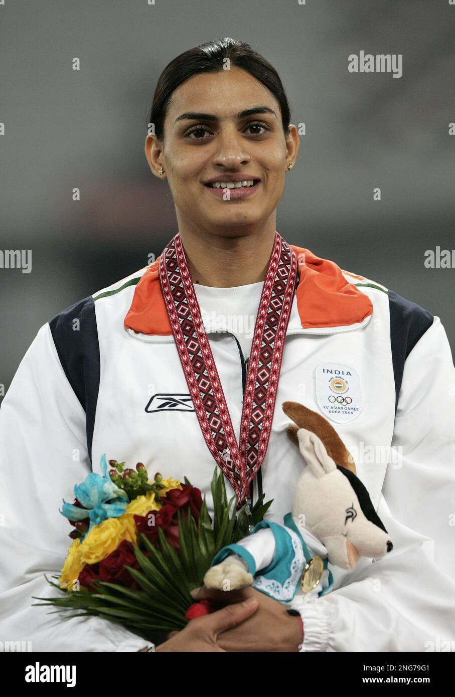 India's Manjeet Kaur who took the silver in the Women's 400m at the Asian Games in Doha, Qatar ...