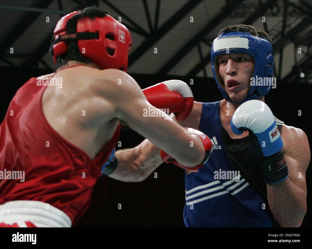 Zhang Jianting of China, left, trades punches with Eishod Rasulov of ...