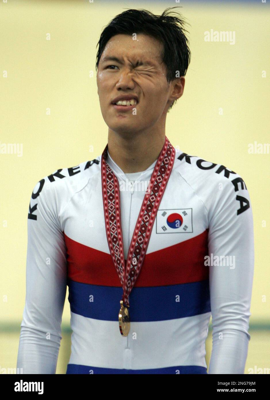 South Korea's Jang Sun-jae races on the podium after receiving the gold ...