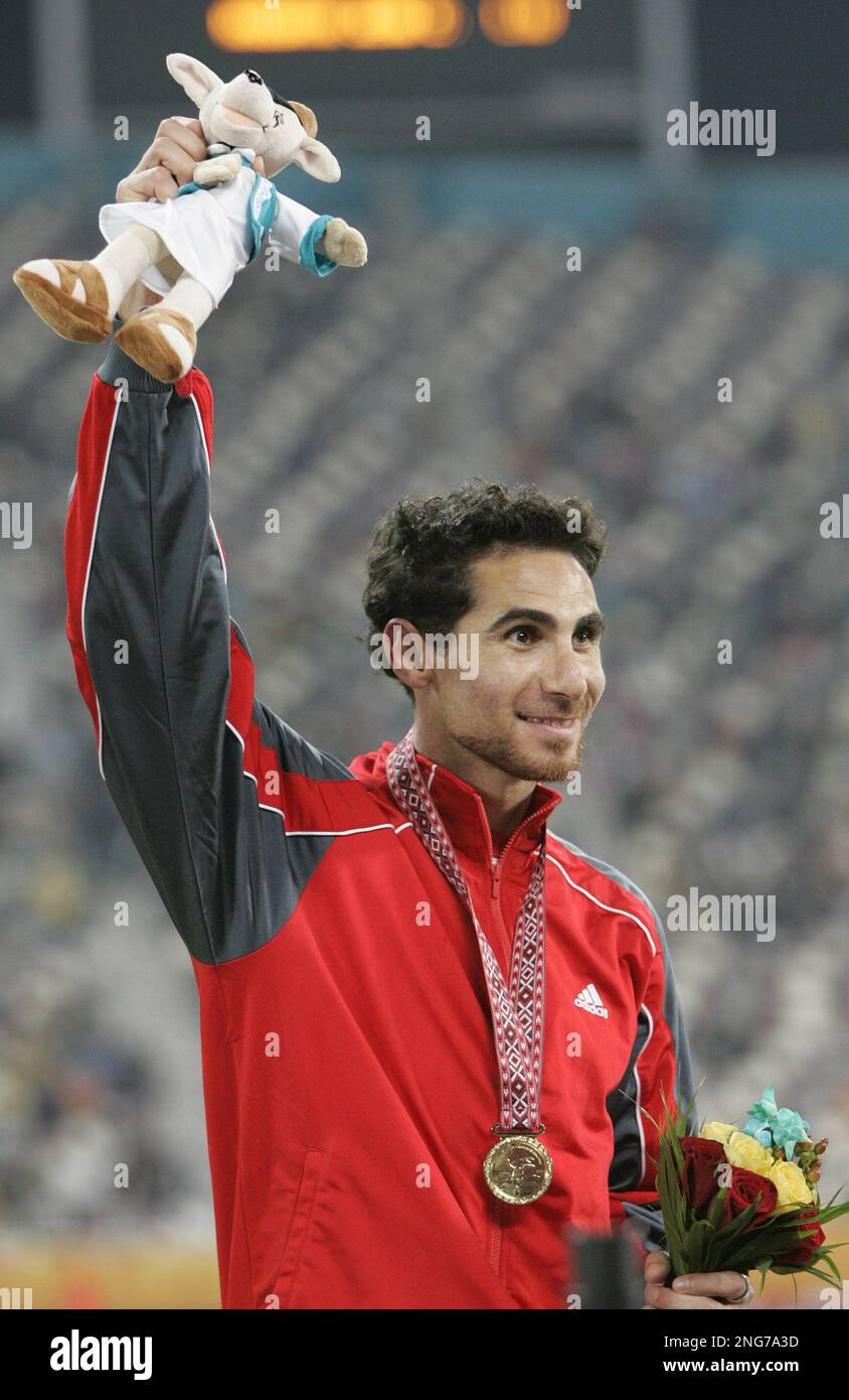 Lebanon's Jean Claude Rabbath the gold medal winner stands on the ...