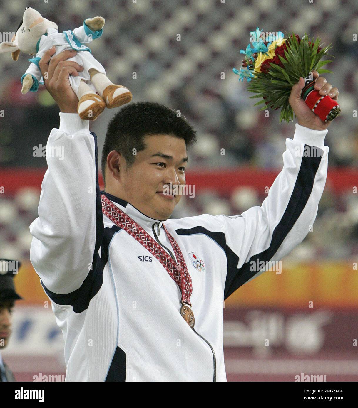 Japan's Hiroaki Doi waves after receiving the bronze medal in the final ...