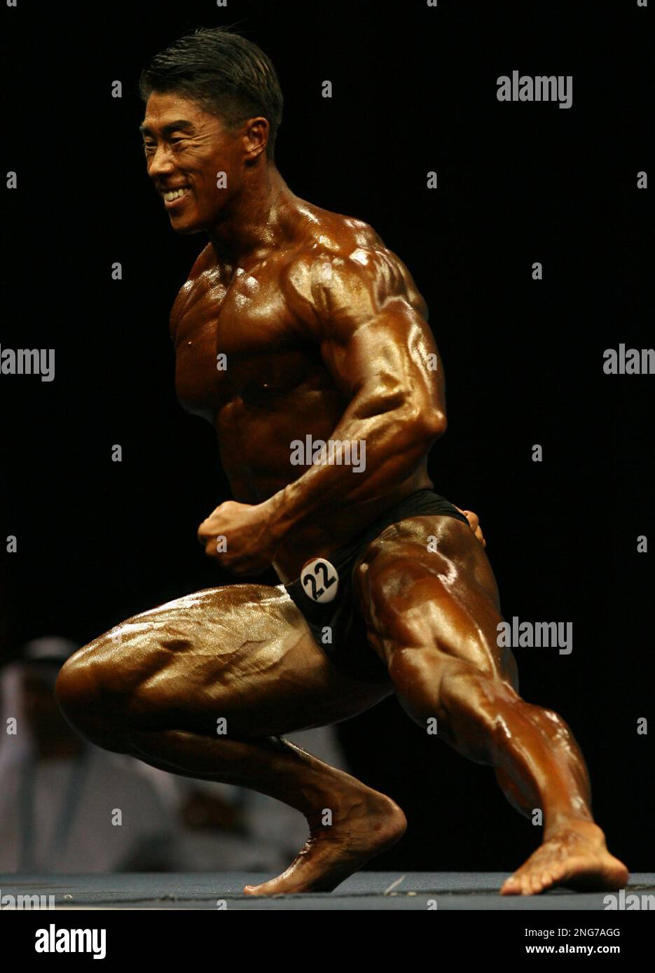 Chan Yun To of Hong Kong performs during the Asian Games Bodybuilding ...