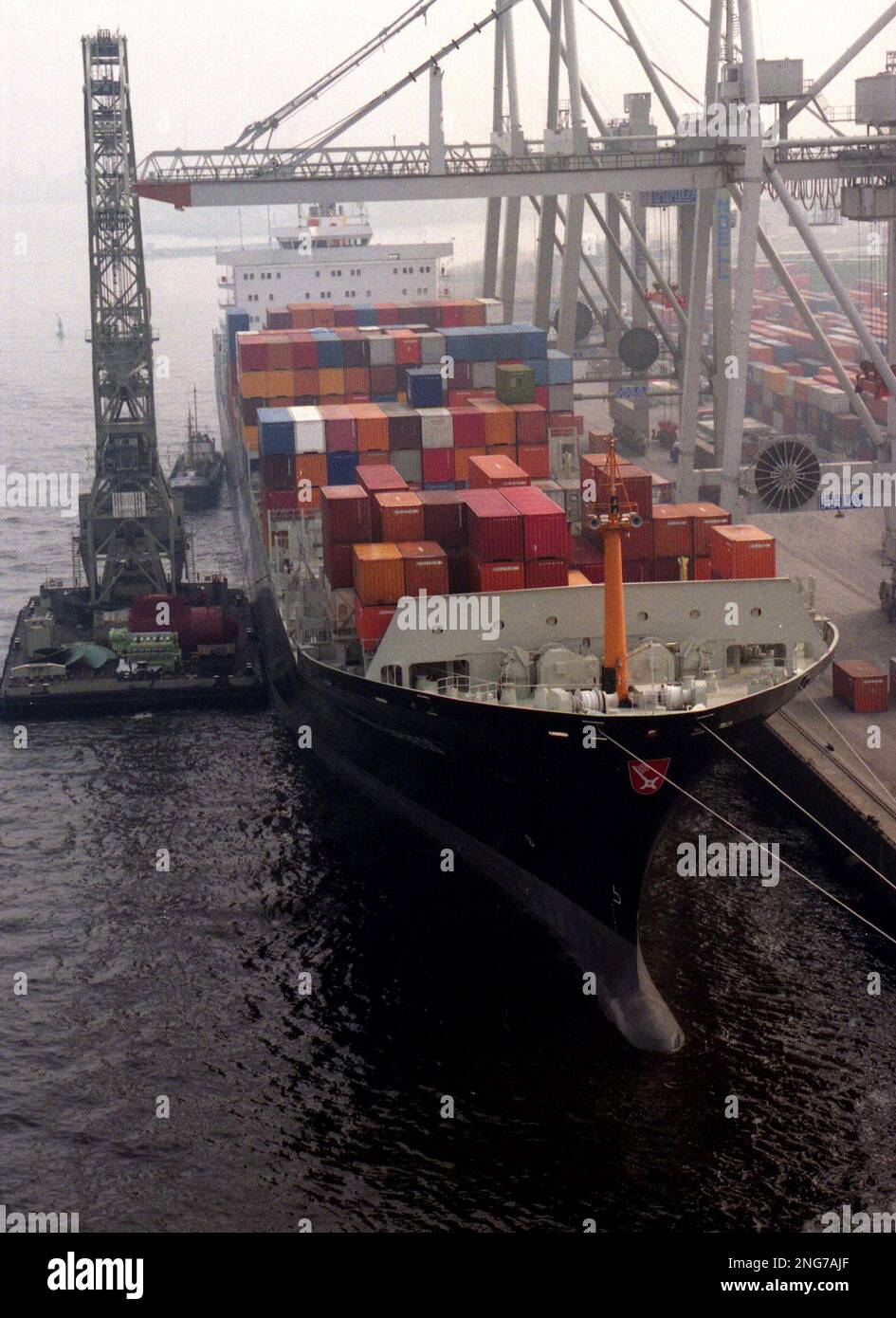 The new container ship 'Hannover Express' is unloaded by cranes in the ...