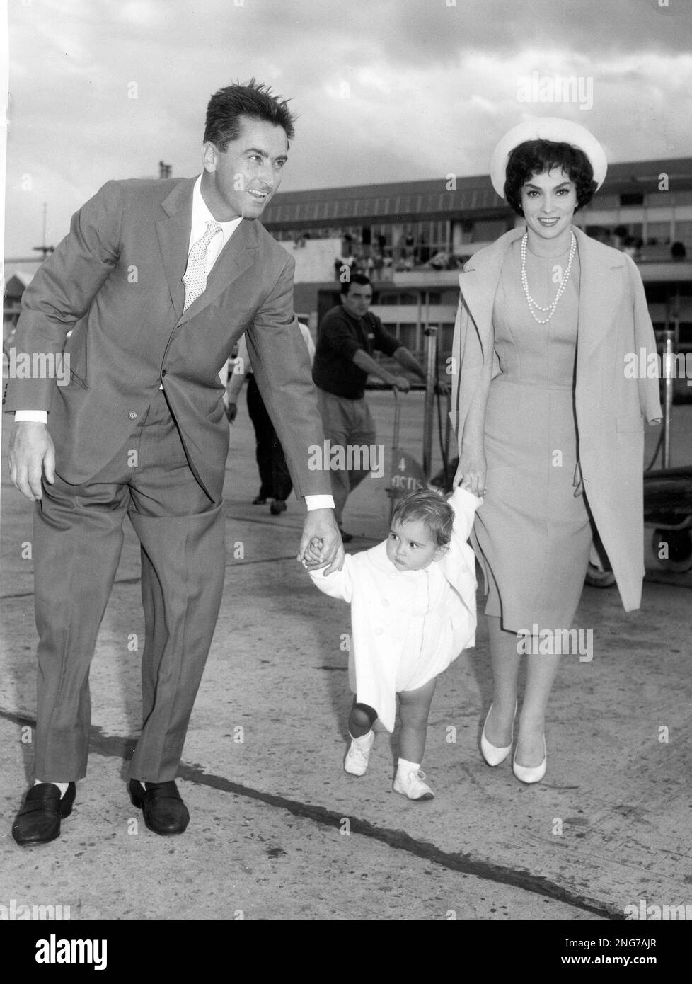 Italian actress Gina Lollobrigida and her husband Milko Skofic Sr. hold ...