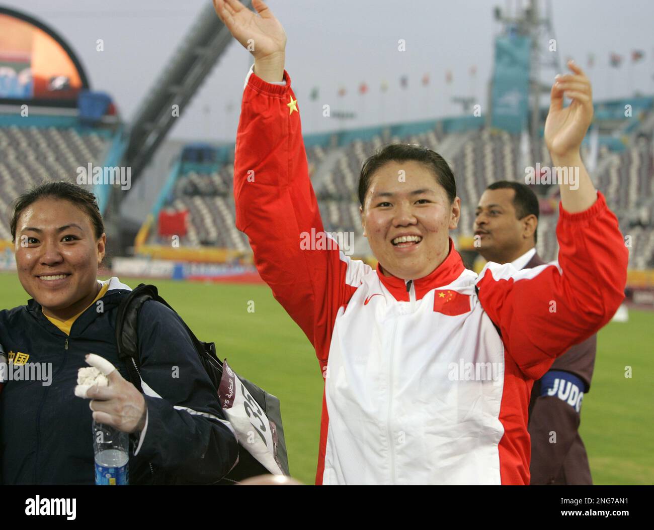 China's Zhang Wenxiu, right, reacts after winning the gold medal with ...