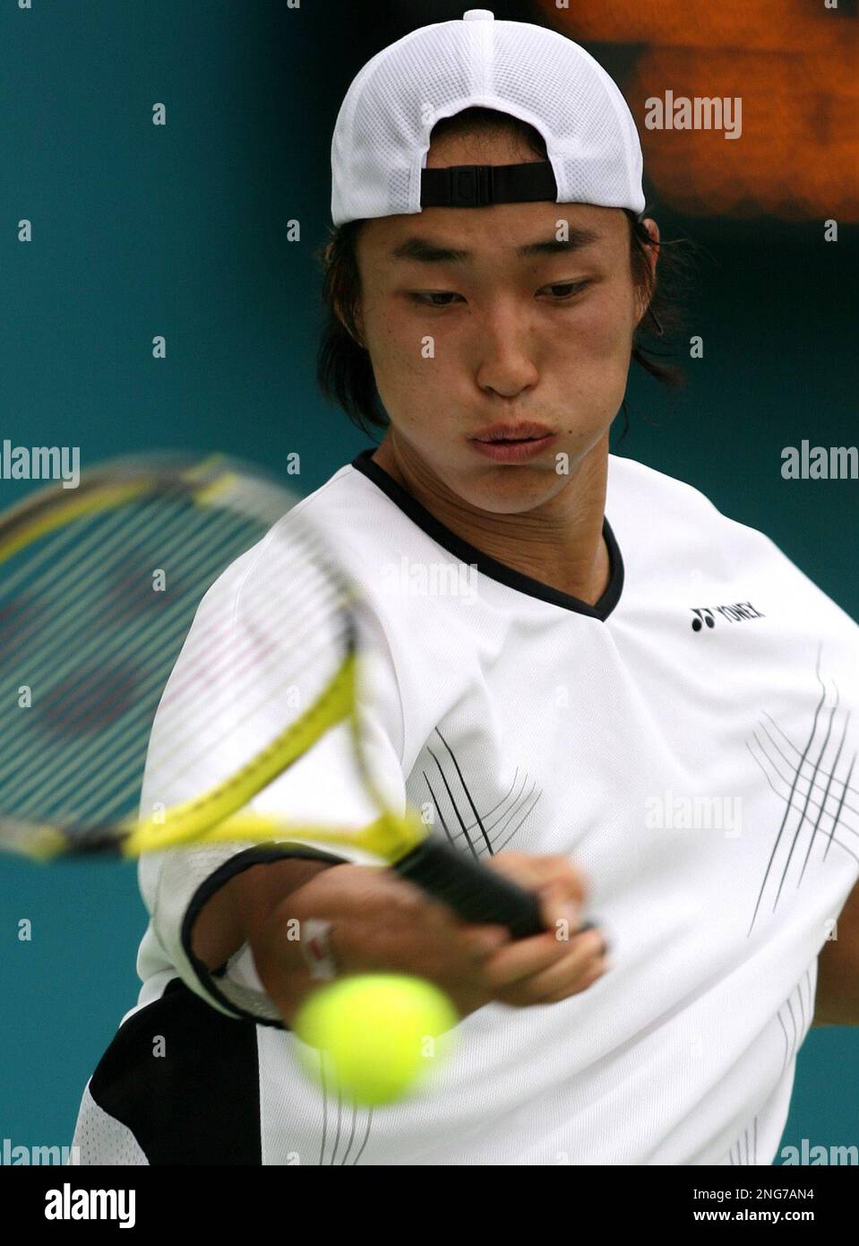 Japan's Go Soeda smashes the ball against South Korea's Lee Hyung-taik ...