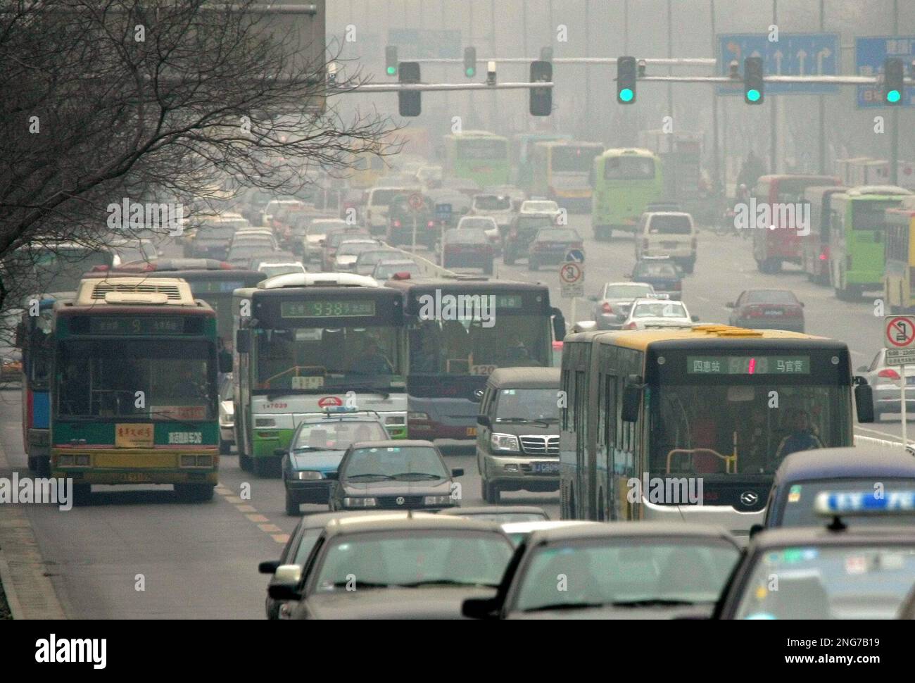 Buses crowd a street in Beijing Friday Dec. 8, 2006. City authorities ...