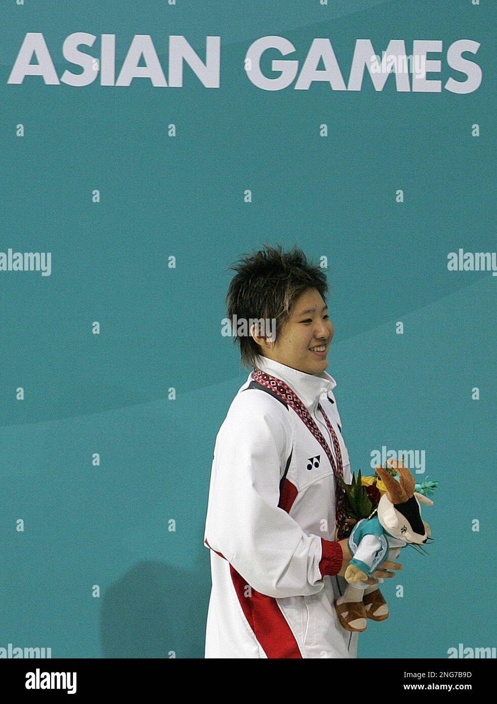 Singapore's Li Tao walks from the podium after receiving the gold medal ...