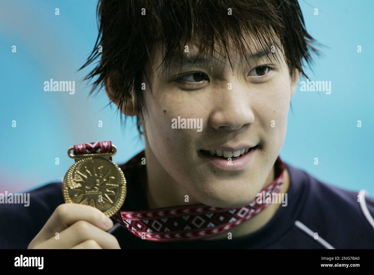 South Korea's gold medalist Park Tae-hwan holds his gold medal after ...