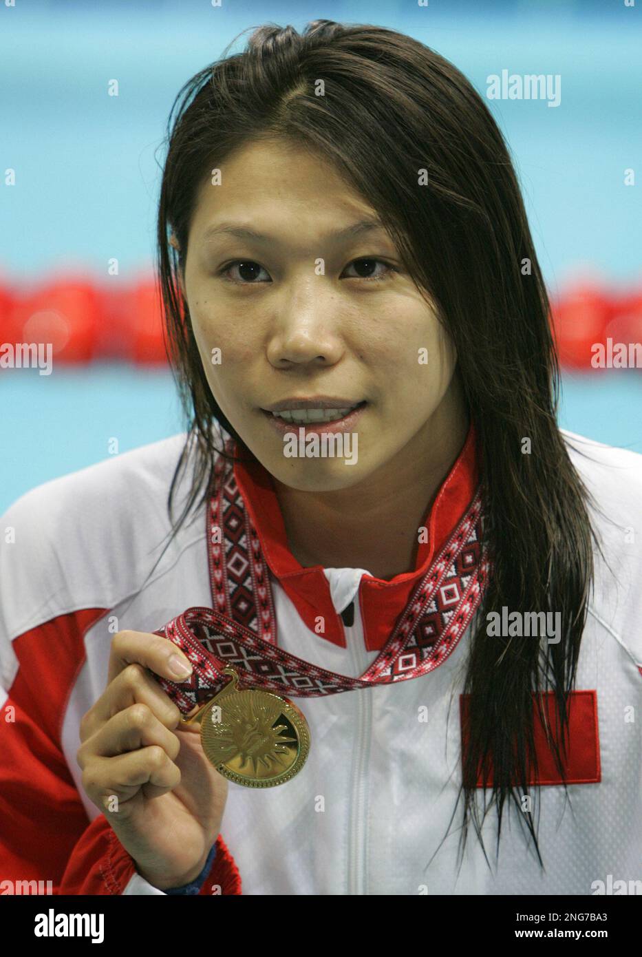 China's Qi Hui holds the gold medal she won in the final of the Women's ...