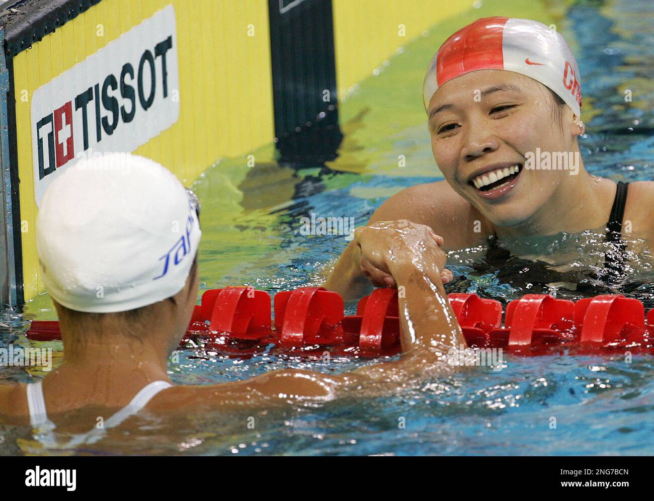 China's Qi Hui, right, who took the gold medal greets silver medalist ...