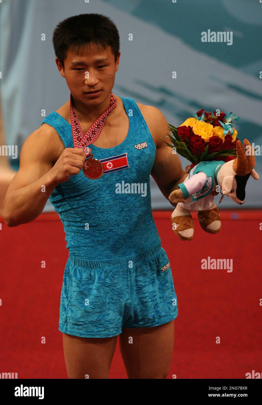 North Korea's Ri Se Gwang displays the medal he won in the Asian Games ...
