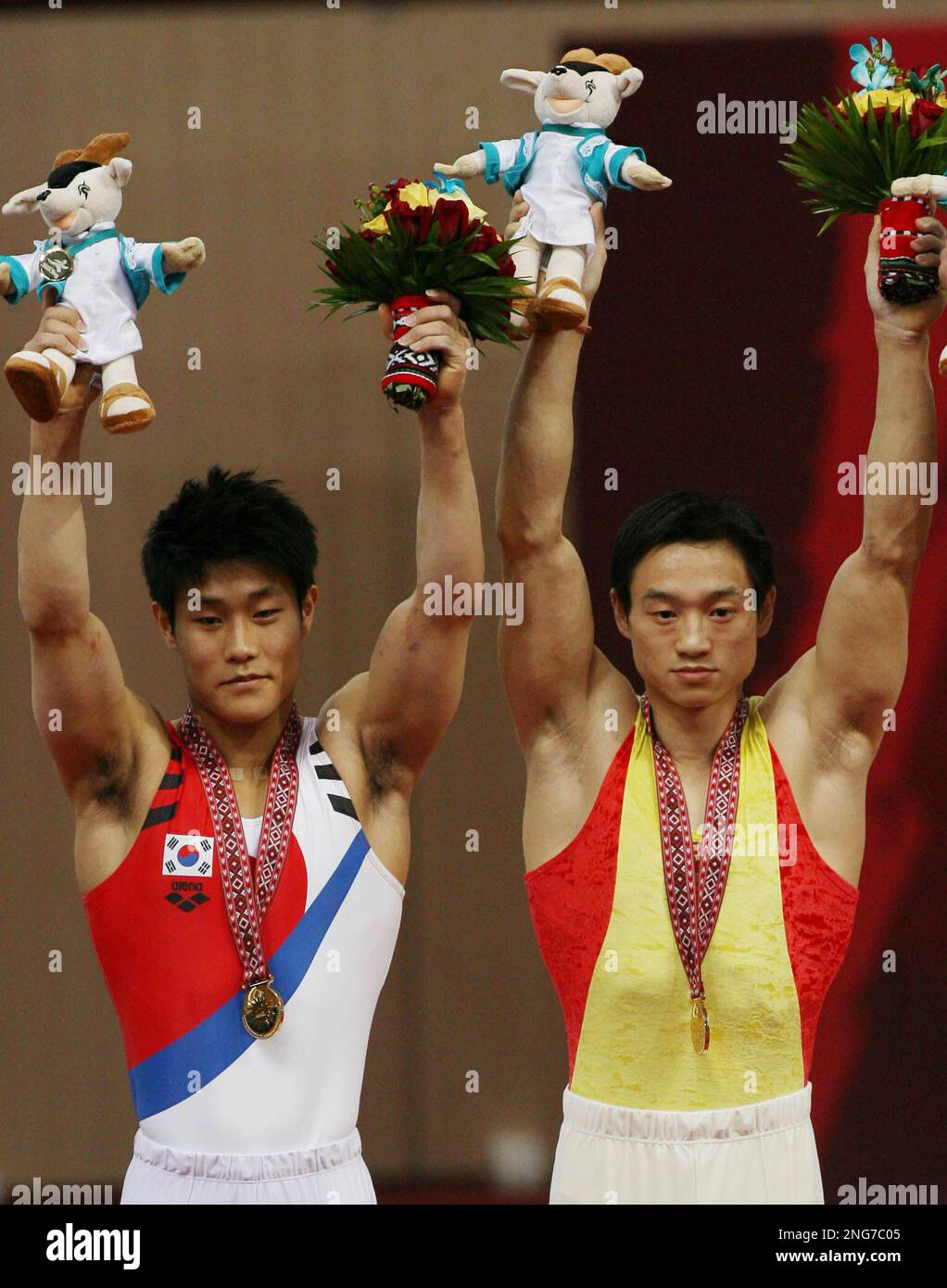 Gold medalists Yang Wei of China, right, and Kim Dae-eun of South Korea ...