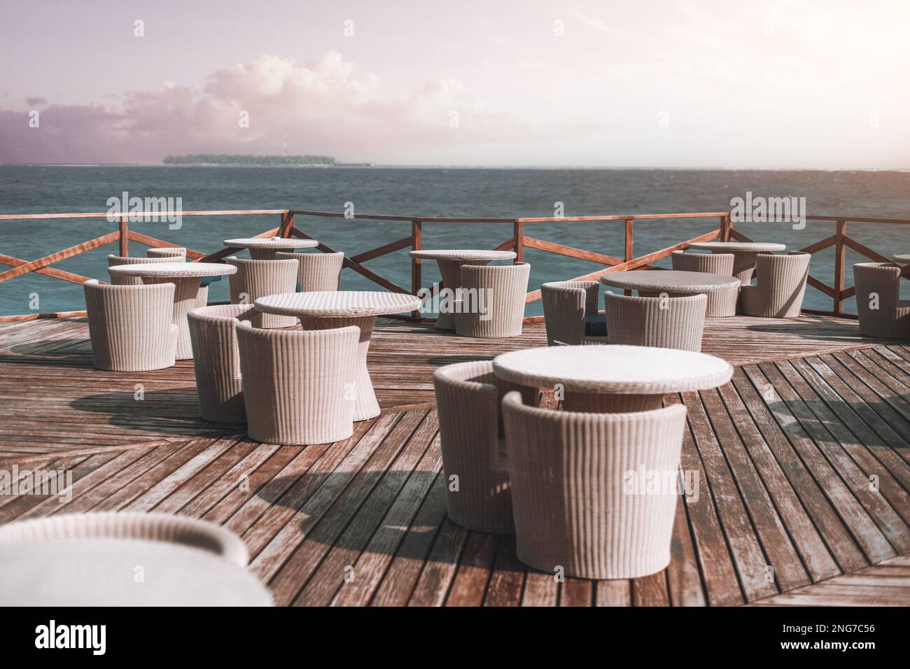 View of an serene outside cafe restaurant area filled by the beach ...