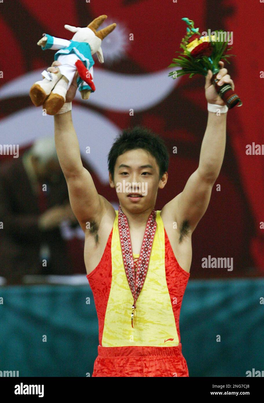 Gold medalist Zhou Kai of China celebrates after winning the Gymnastics ...
