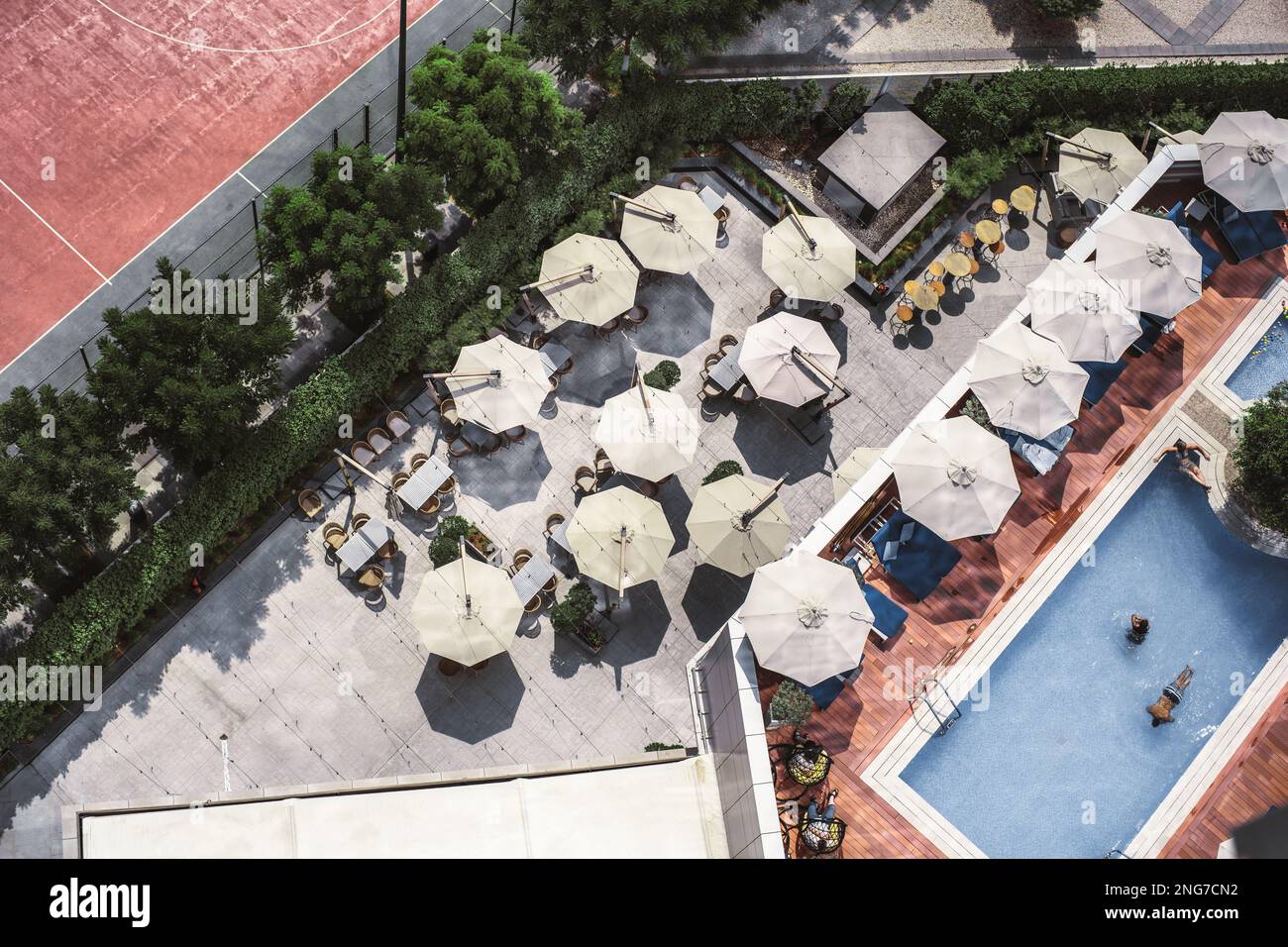 Top view from a drone of an outdoor bar with sunshades creating a ...