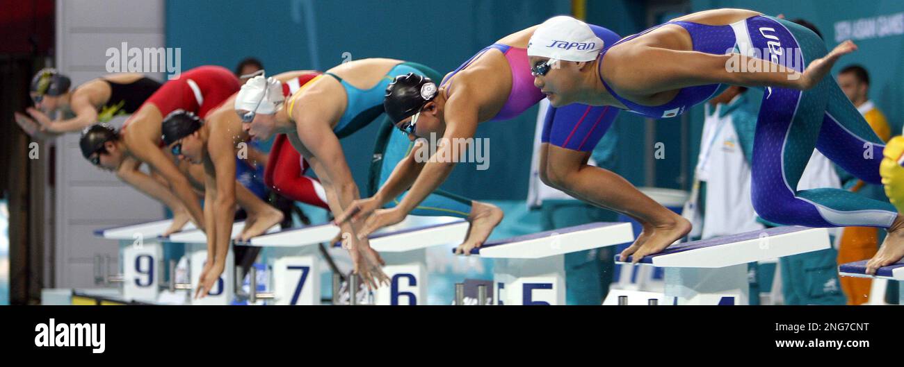 Japan's Norie Urabi, right, starts a Women's 50m freestyle heat at the ...