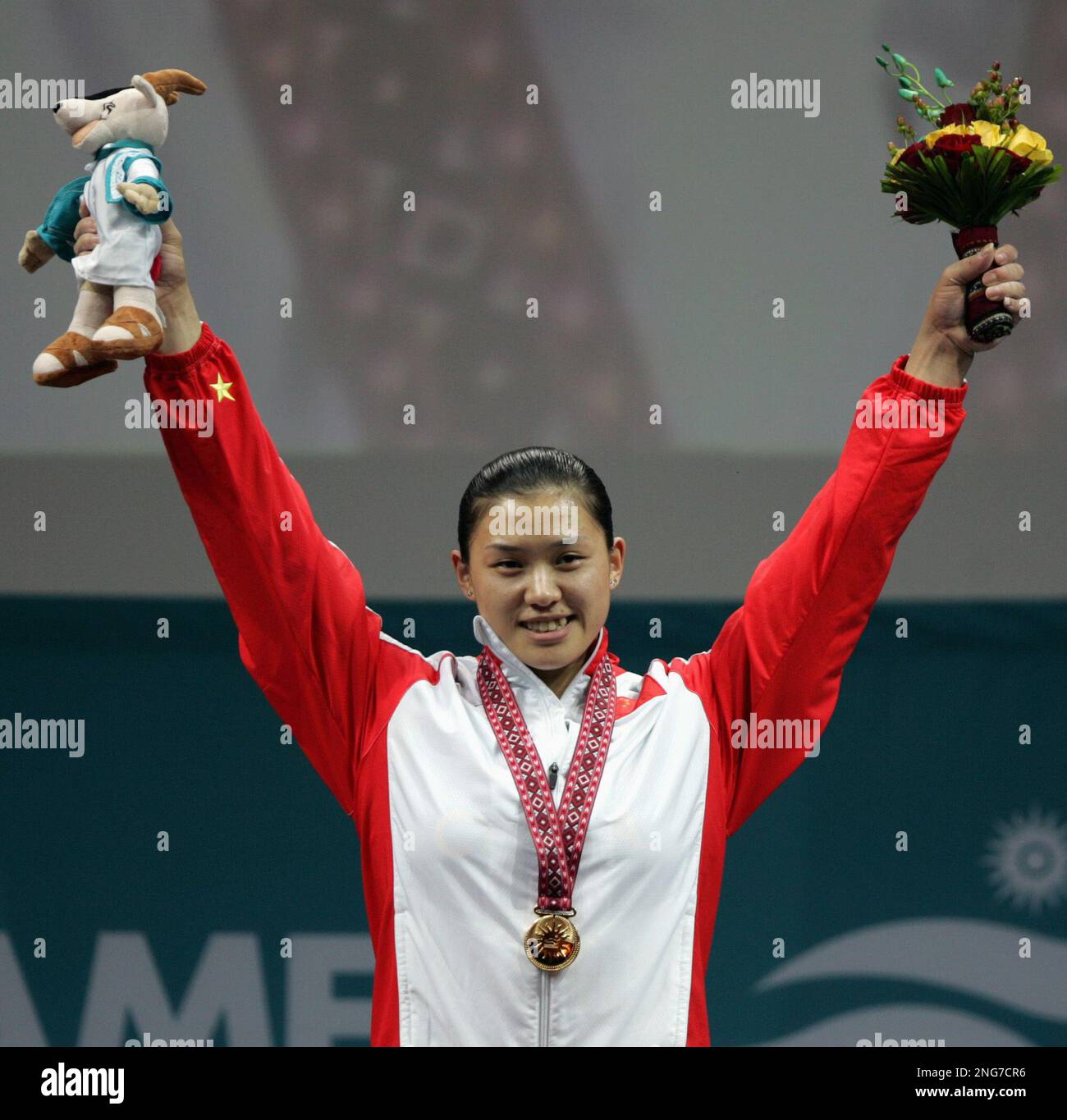 China's Cao Lei celebrates her gold medal victory in the women's 75kg ...