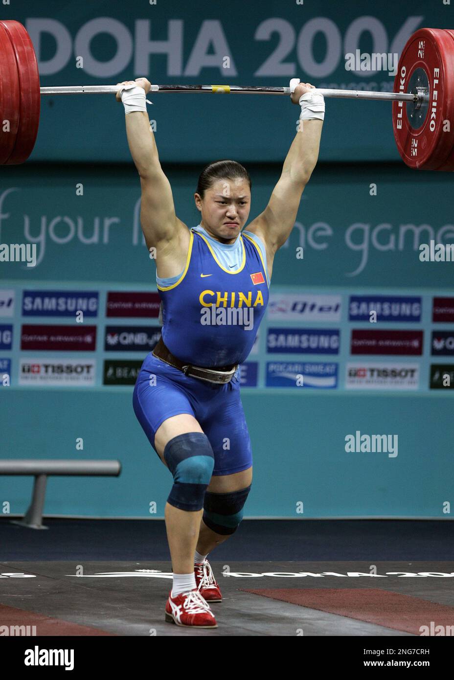 China's Cao Lei lifts up 152 kg in clean and jerk on her way to win the ...
