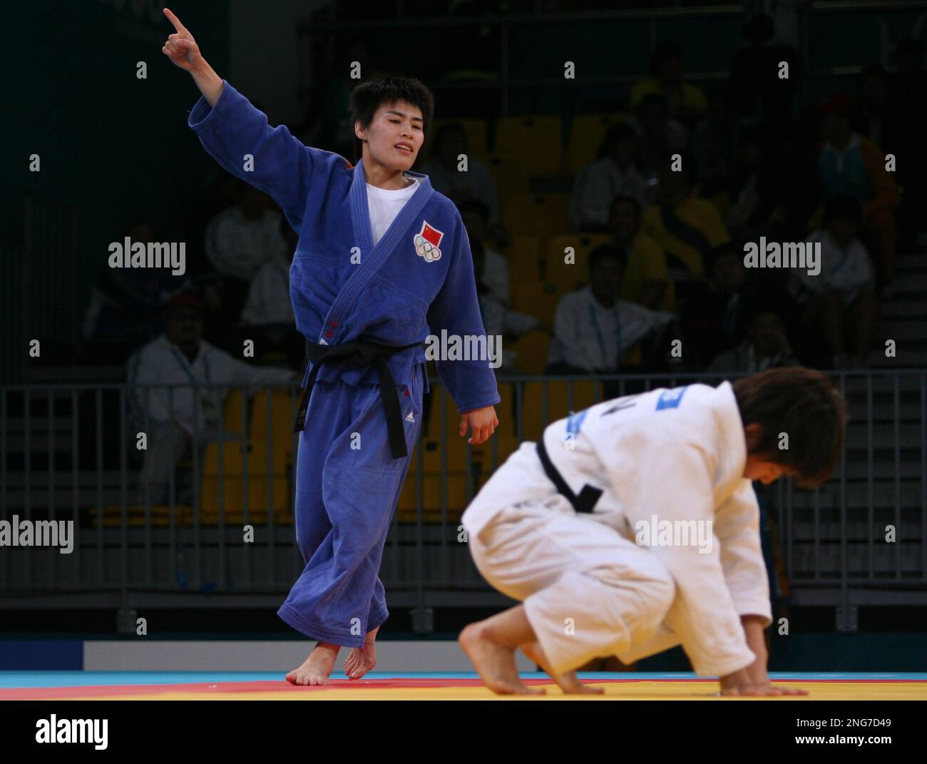 Xu Yan of China reacts after defeating Aiko Sato of Japan in the Women's 57kg judo final at the ...
