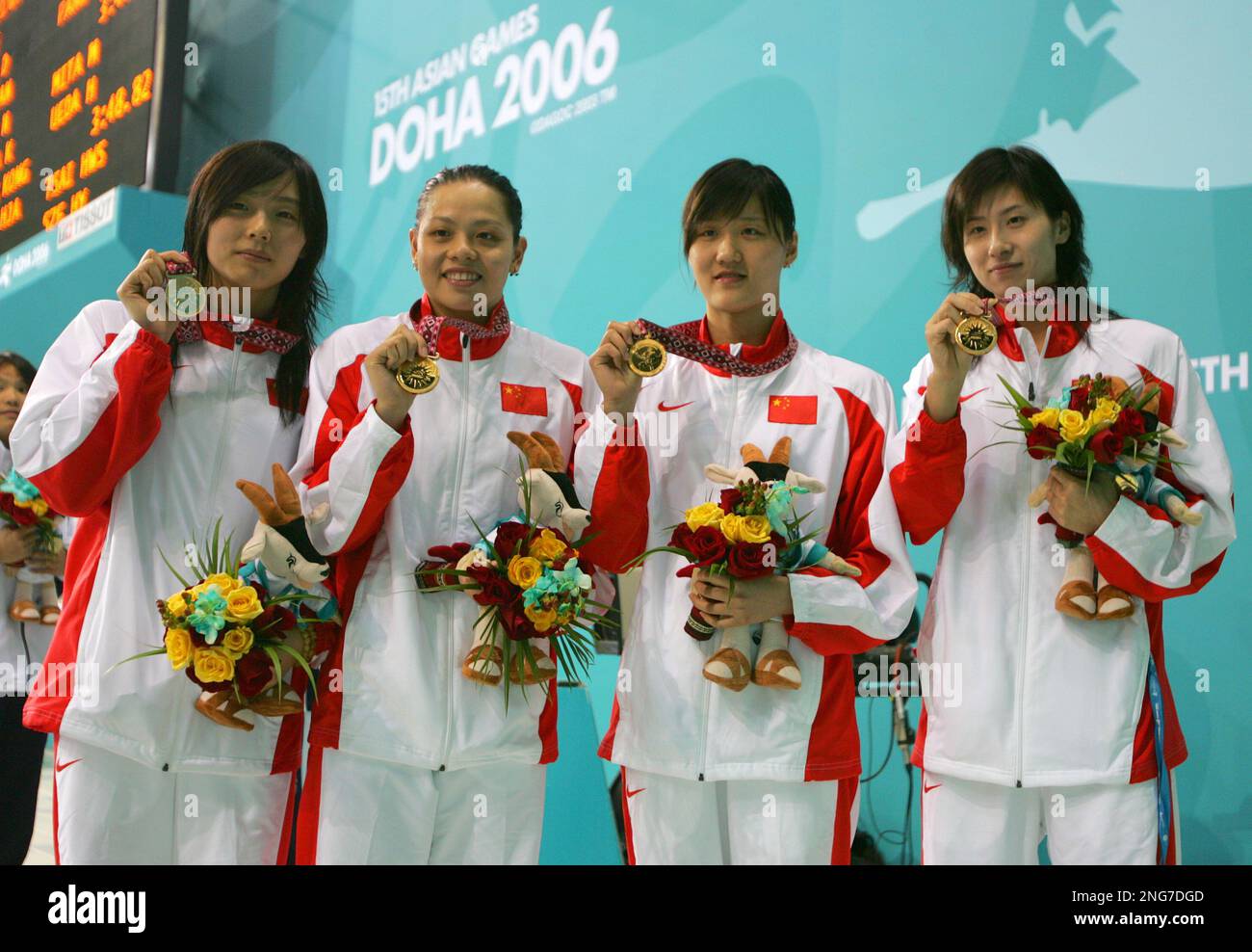 The Chinese team who took the gold medal pose for photographers after ...