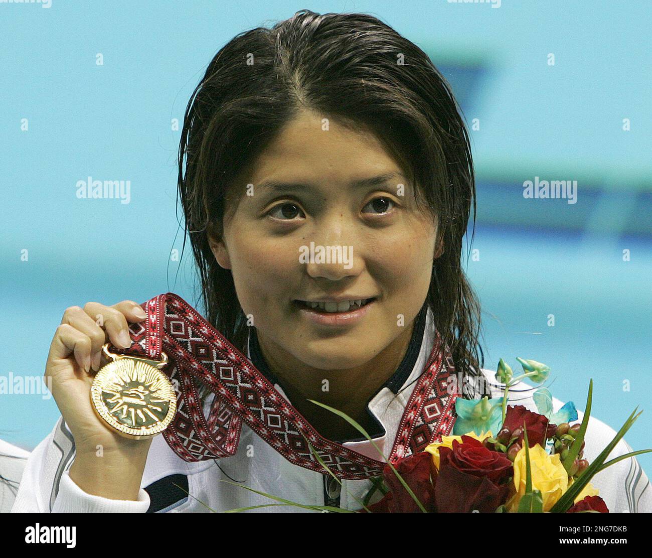 Japan's Reiko Nakamura holds the gold medal she won in the final of the ...