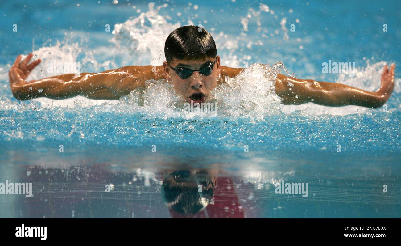 Syria's Rami Anys competes in a Men's 100m butterfly heat at the Asian ...