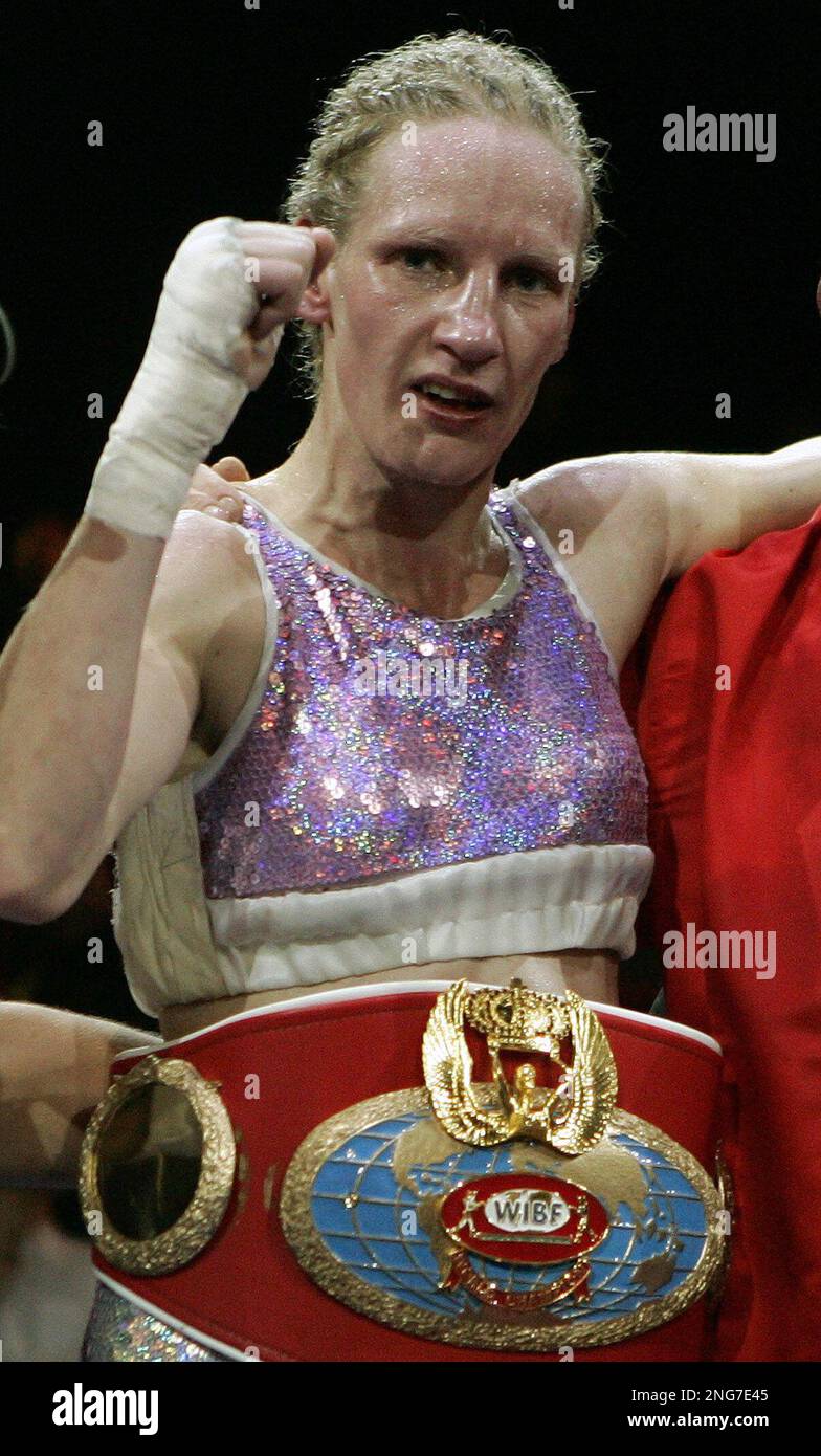 French female boxer Anne-Sophie Mathis wears the belt after she ...