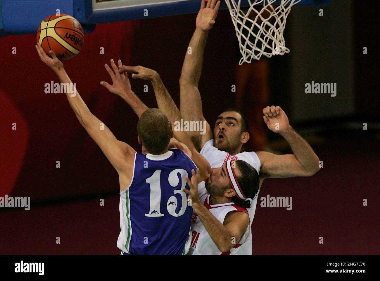 Koslov Aleksandr of Uzbekistan, left, is blocked by Samaha Roy, right ...