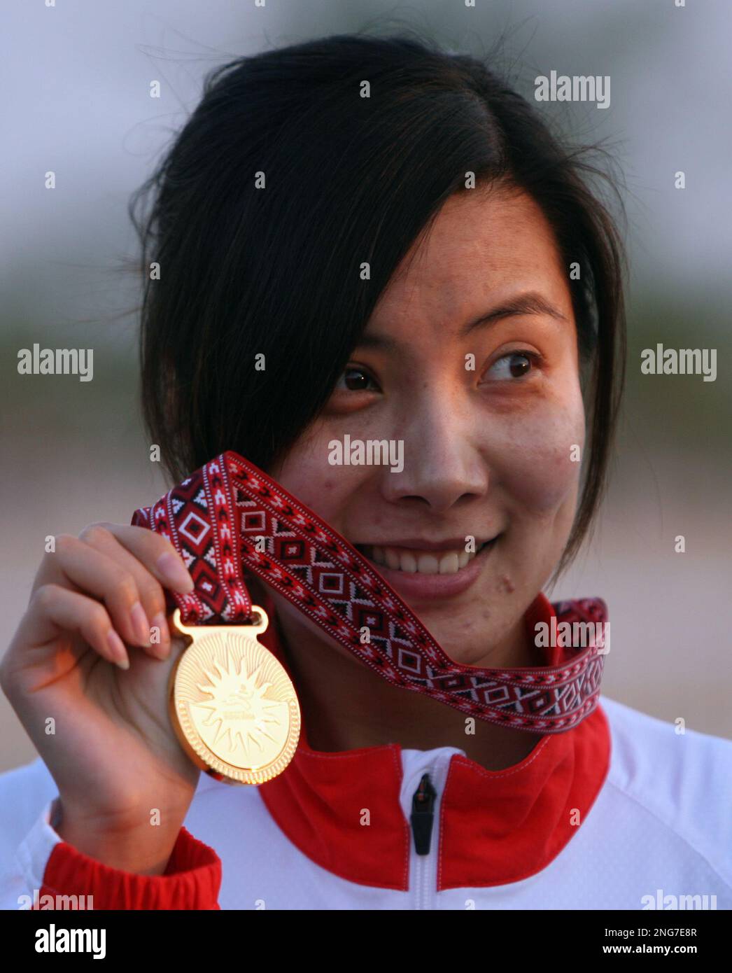 China's Li Du poses for photographers with the gold medal she won in ...