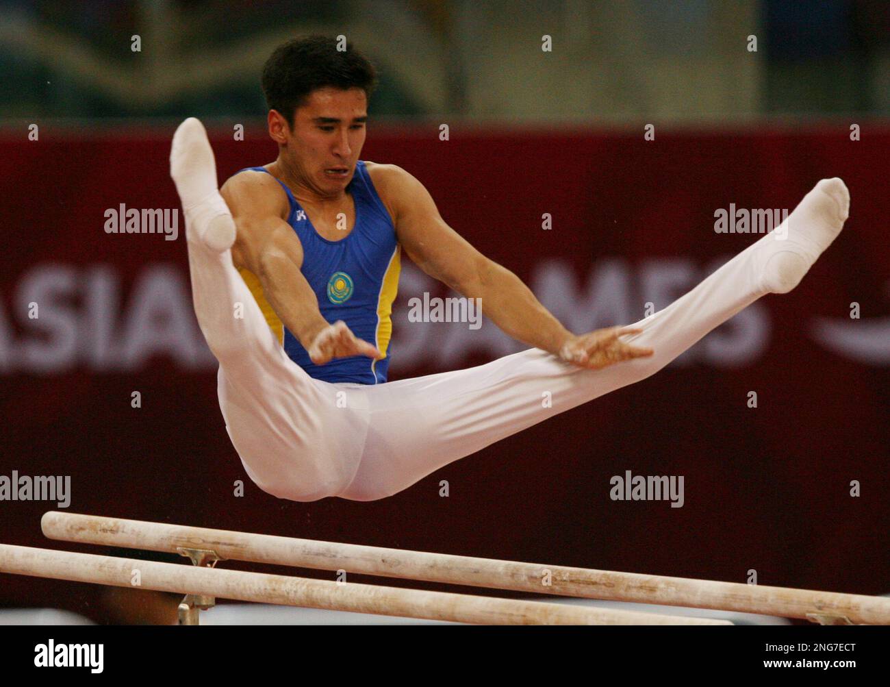 Yernar Yerimbetov of Kazakstan performs at the Parallel Bars during the ...