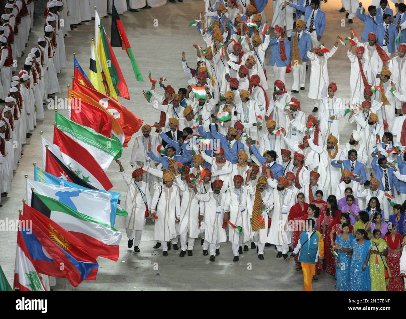 The Indian team enter the arena during the Opening Ceremony of the 15th ...