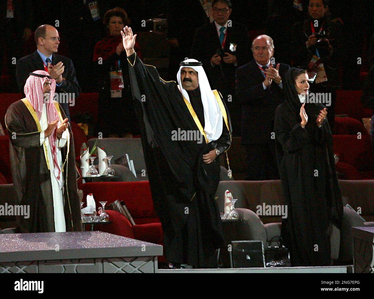 The Emir of Qatar, Hamad bin Khalifa Al Thani, center, waves as he ...