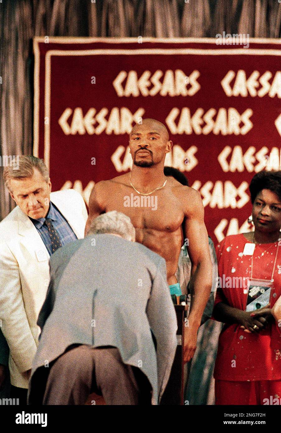 Sugar Ray Leonard raises his arms in a victory pose, as Marvin Hagler ...
