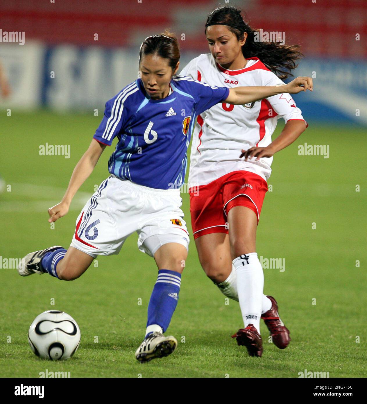 Japan's Tomoie Sakai, left, controls the ball as Jordan player Stefani ...